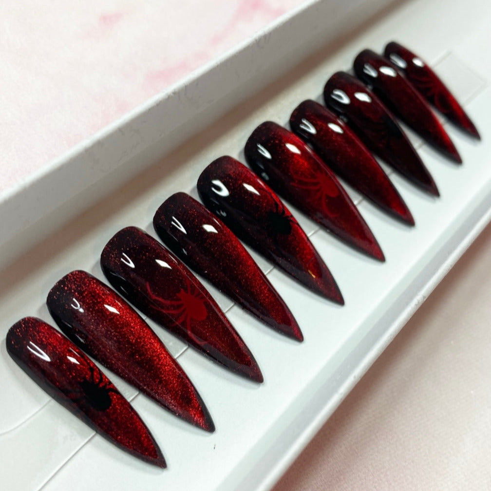 Blood red cat eye spider false nails handmade by UK-based nail artist ...