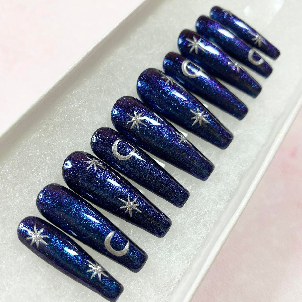 Blue celestial moon-star press-on nails from a UK-based nail artist ...